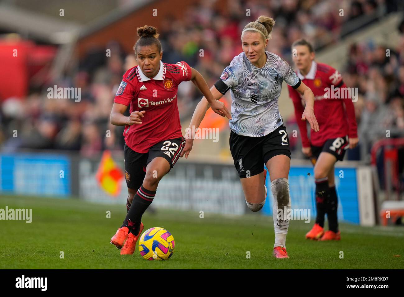 Nikita Parris #22 of Manchester United breaks past Emma Koivisto #2 of ...