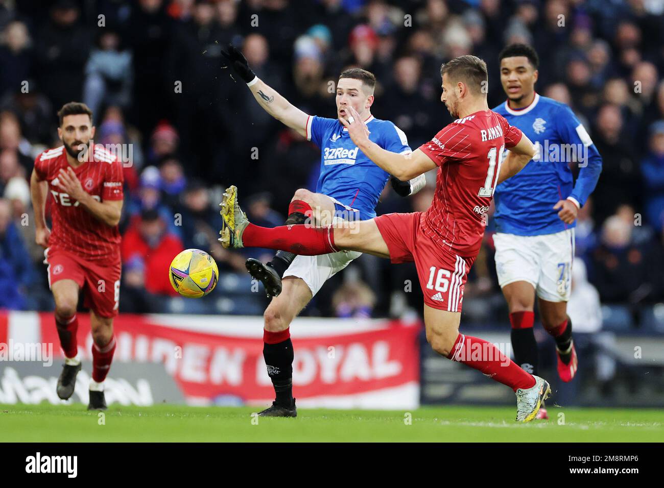Rangers' John Lundstram (left) and Aberdeen Ylber Ramadani battle for ...