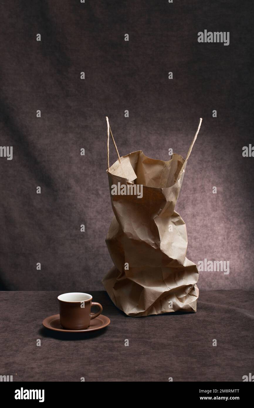 Still life with a paper bag and a coffee cup Stock Photo - Alamy