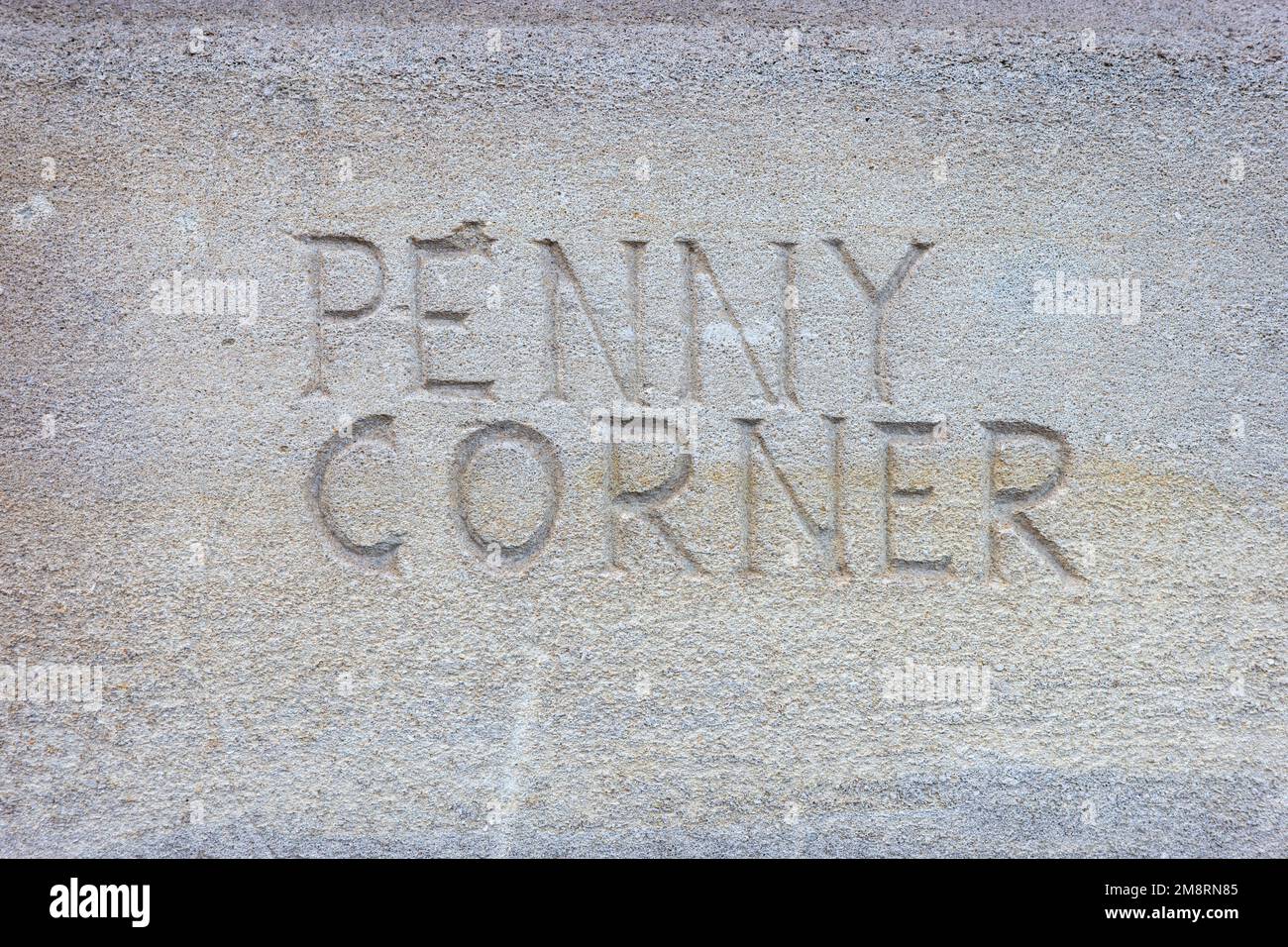 Penny Corner carved in stone Stock Photo - Alamy