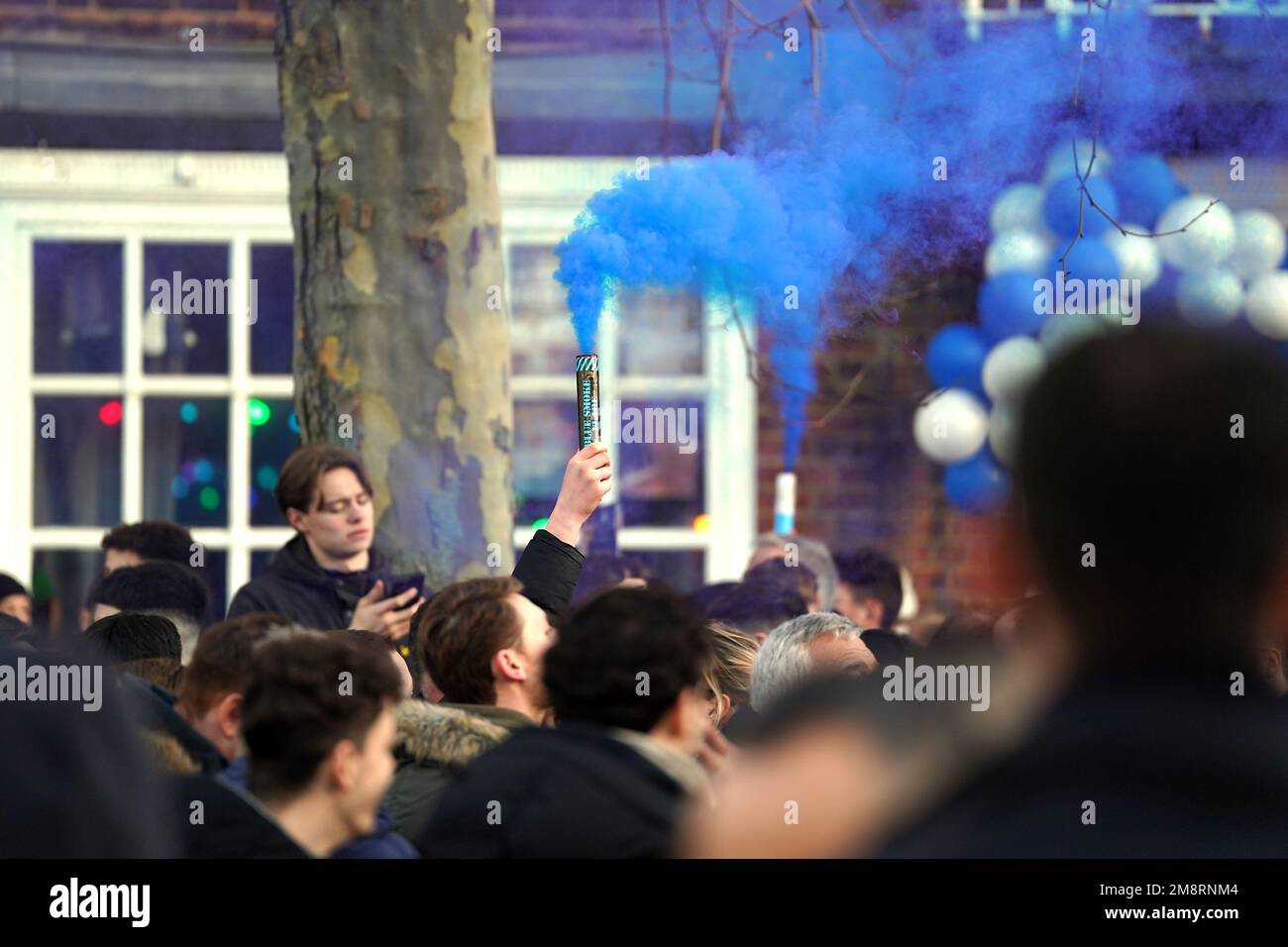 Tottenham Hotspur fans set off smoke flares as they gather outside ...