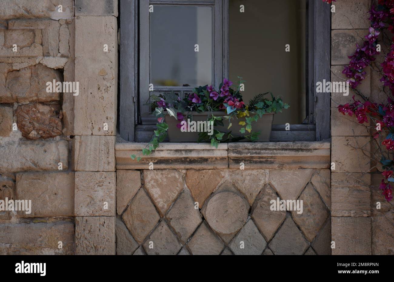 Antique grey wooden window with a sill clay planter on a handcrafted ...
