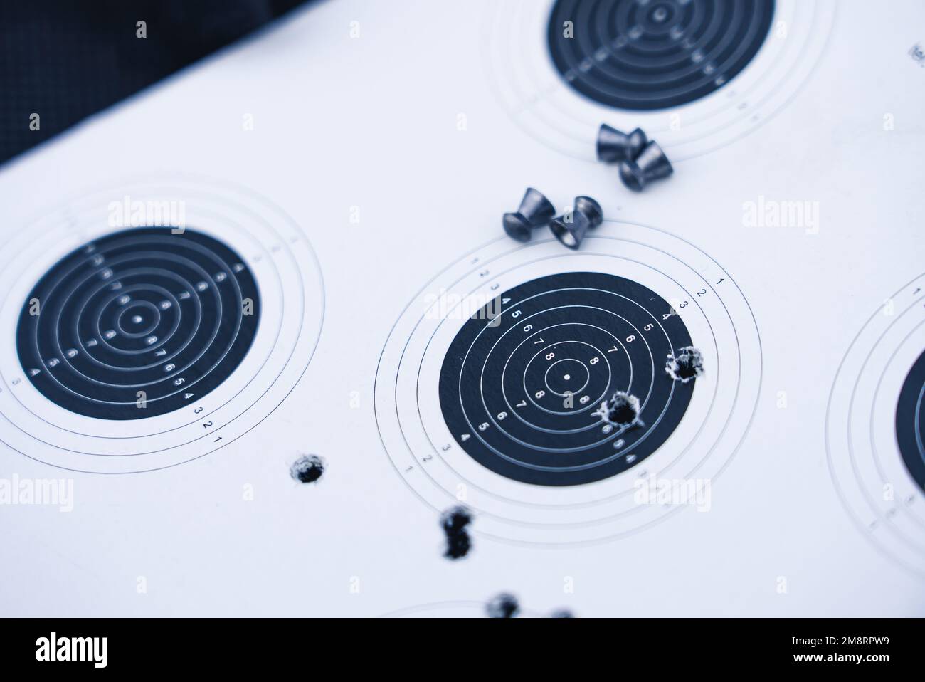 Airgun pellets on a paper shooting target. High quality photo Stock ...
