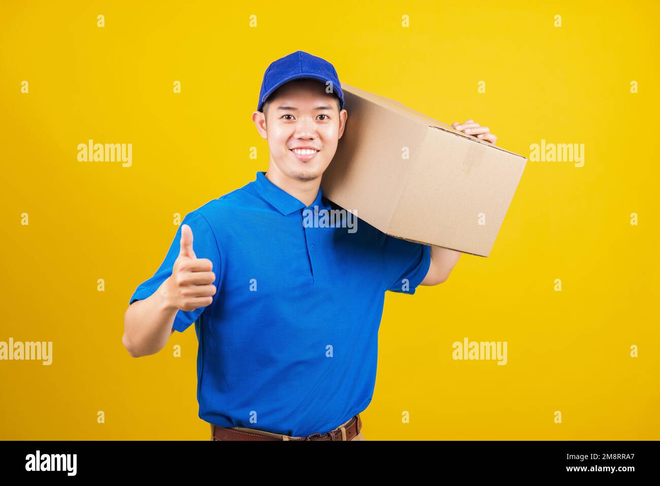 delivery happy man logistic standing he smile wearing blue t-shirt and ...