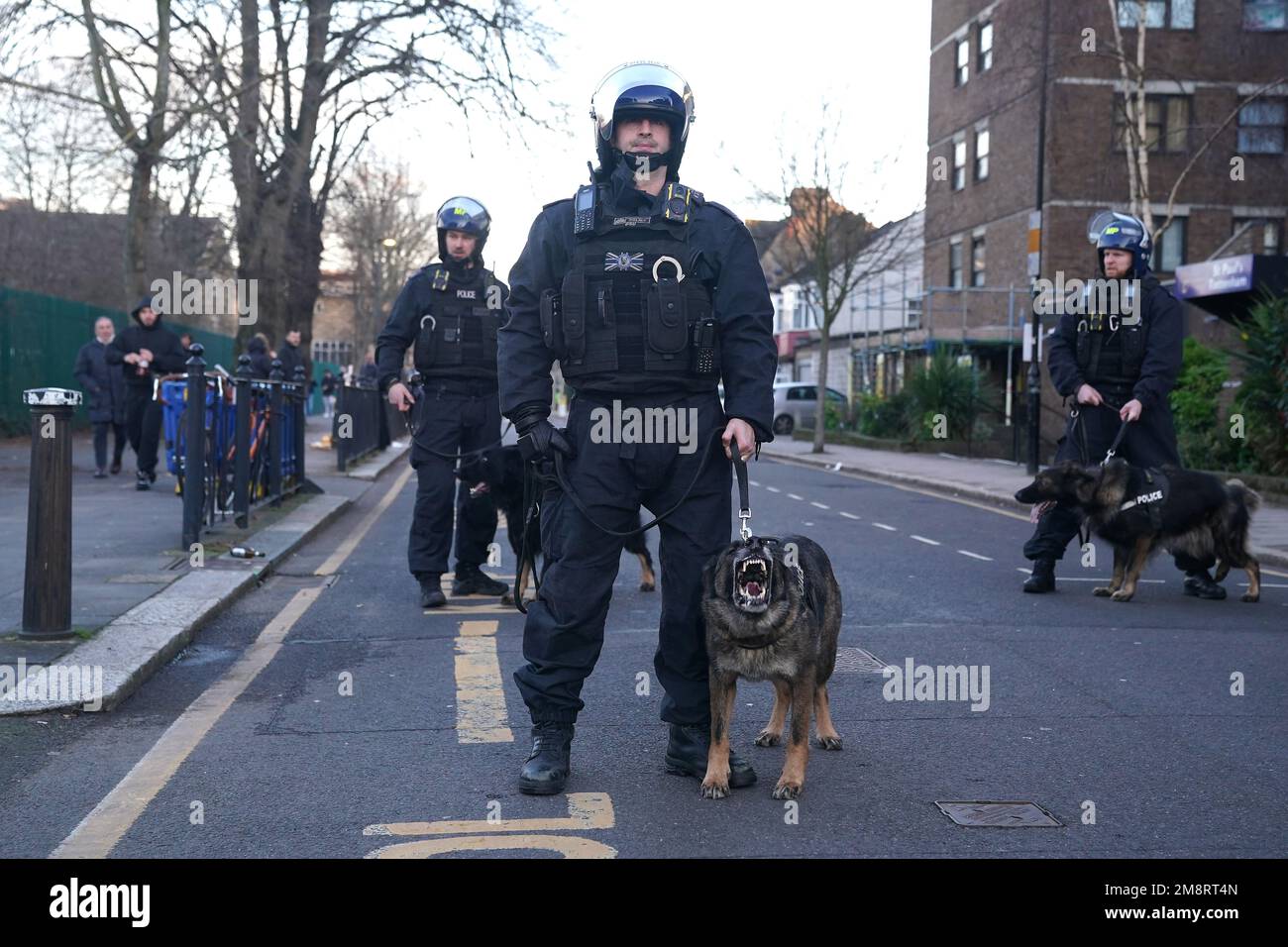 Police with dogs outside the stadium as fans gather before the Premier ...