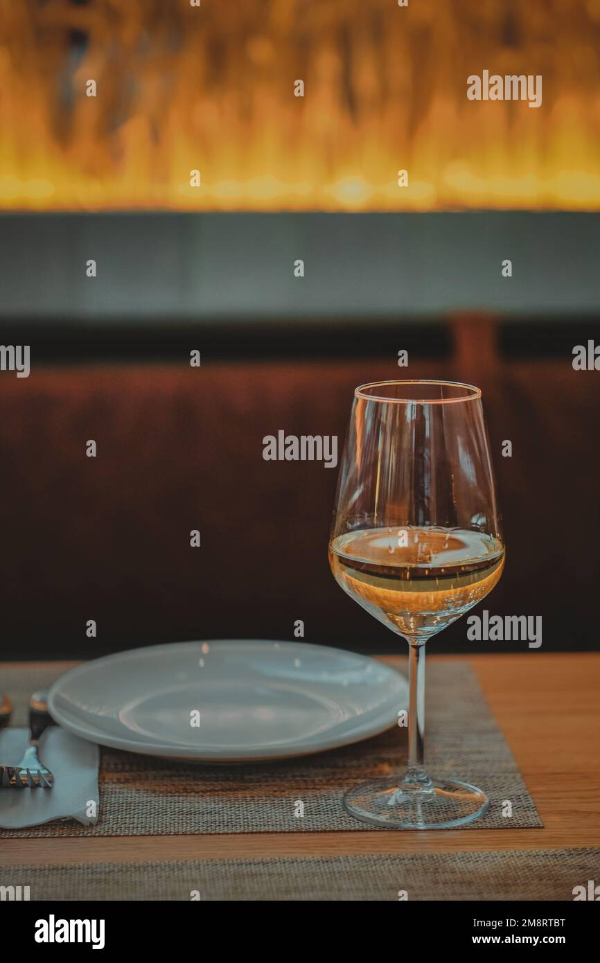 Italian restaurant table with dinner of pasta salad and a glass of wine ...