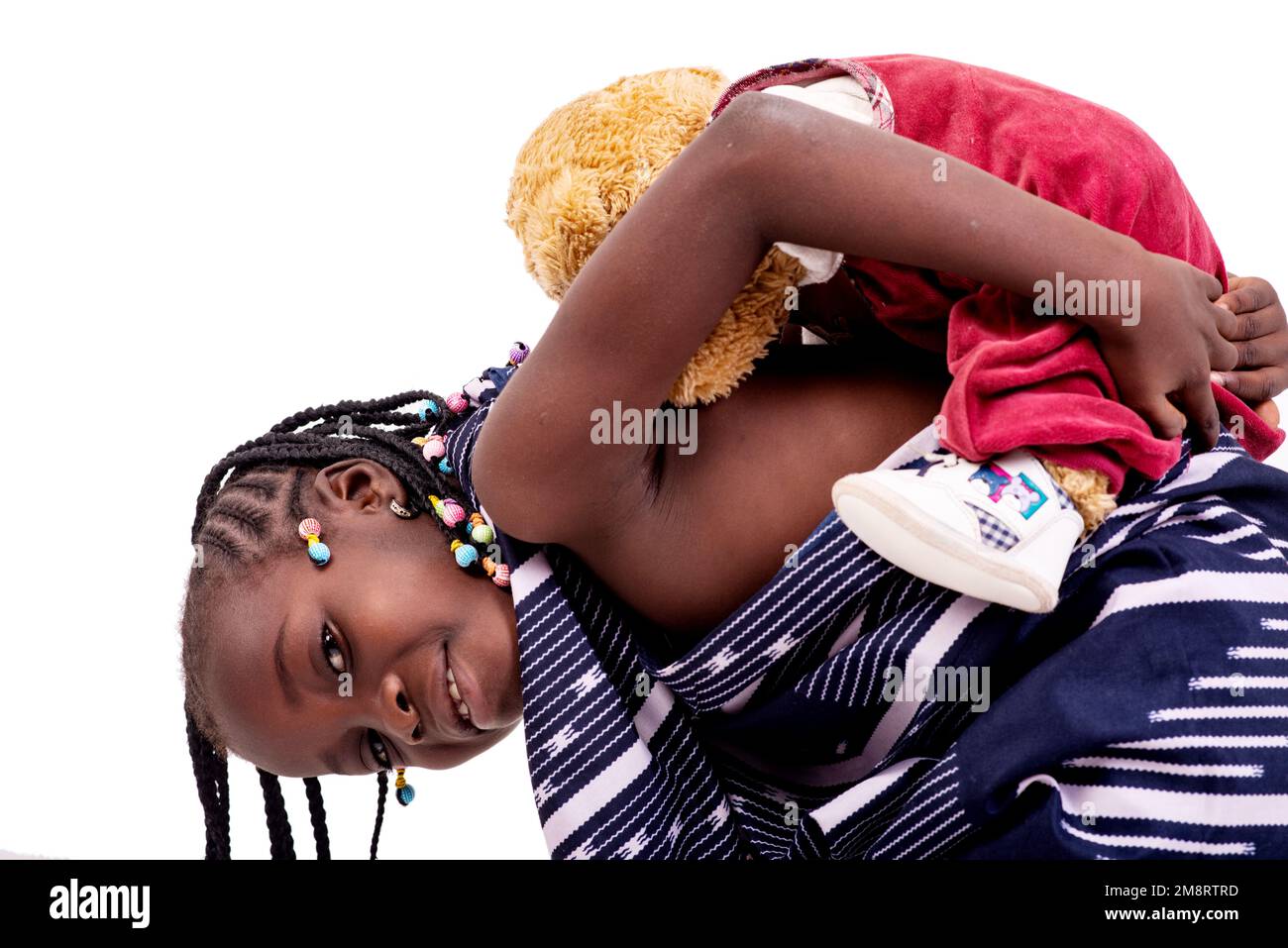 cute little girl wearing traditional african loincloth and carrying her ...