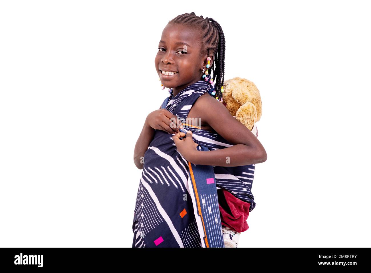 cute little girl wearing traditional African loincloth and carrying her ...