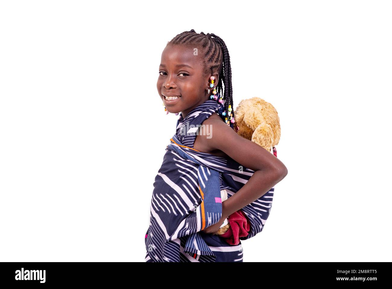 cute little girl wearing traditional African loincloth and carrying her ...