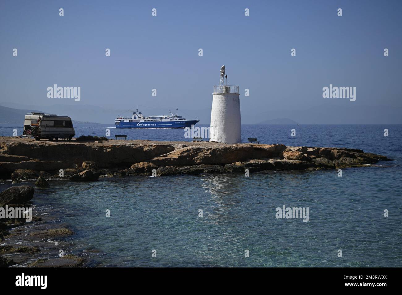 Landscape with scenic view of a local ferry boat off the coast of Bouza ...