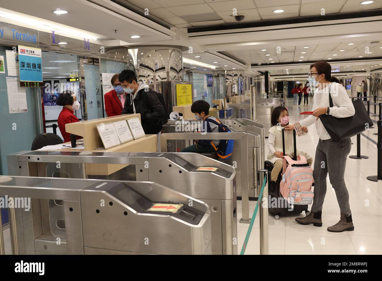 Passengers queue up at China Ferry Terminal in Tsim Sha Tsui. The ...