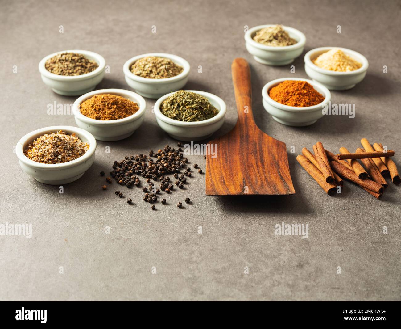 Various spices and cooking utensils in small bowls Stock Photo - Alamy