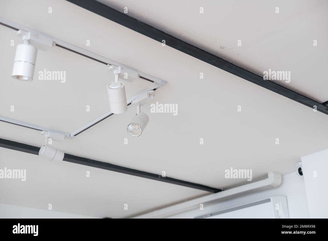 white led spotlight standing in white background. the system runs ...