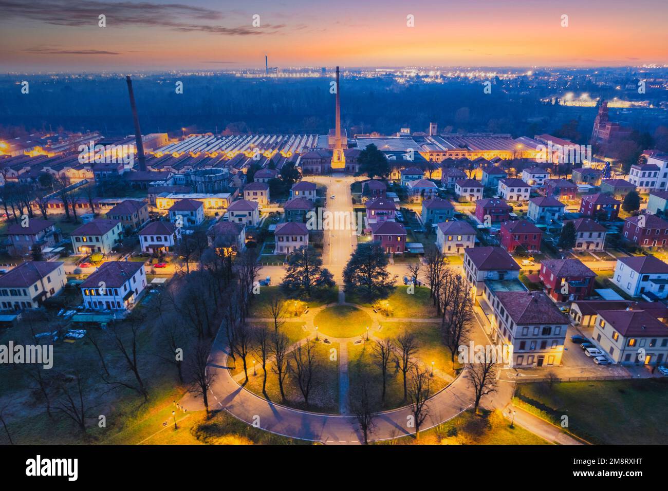 Aerial view of historic worker village of Crespi d'Adda during sunset ...