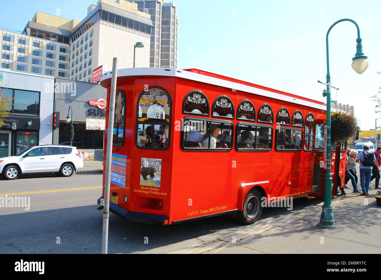 Red sightseeing bus in the city of Anchorage, Alaska, United States ...
