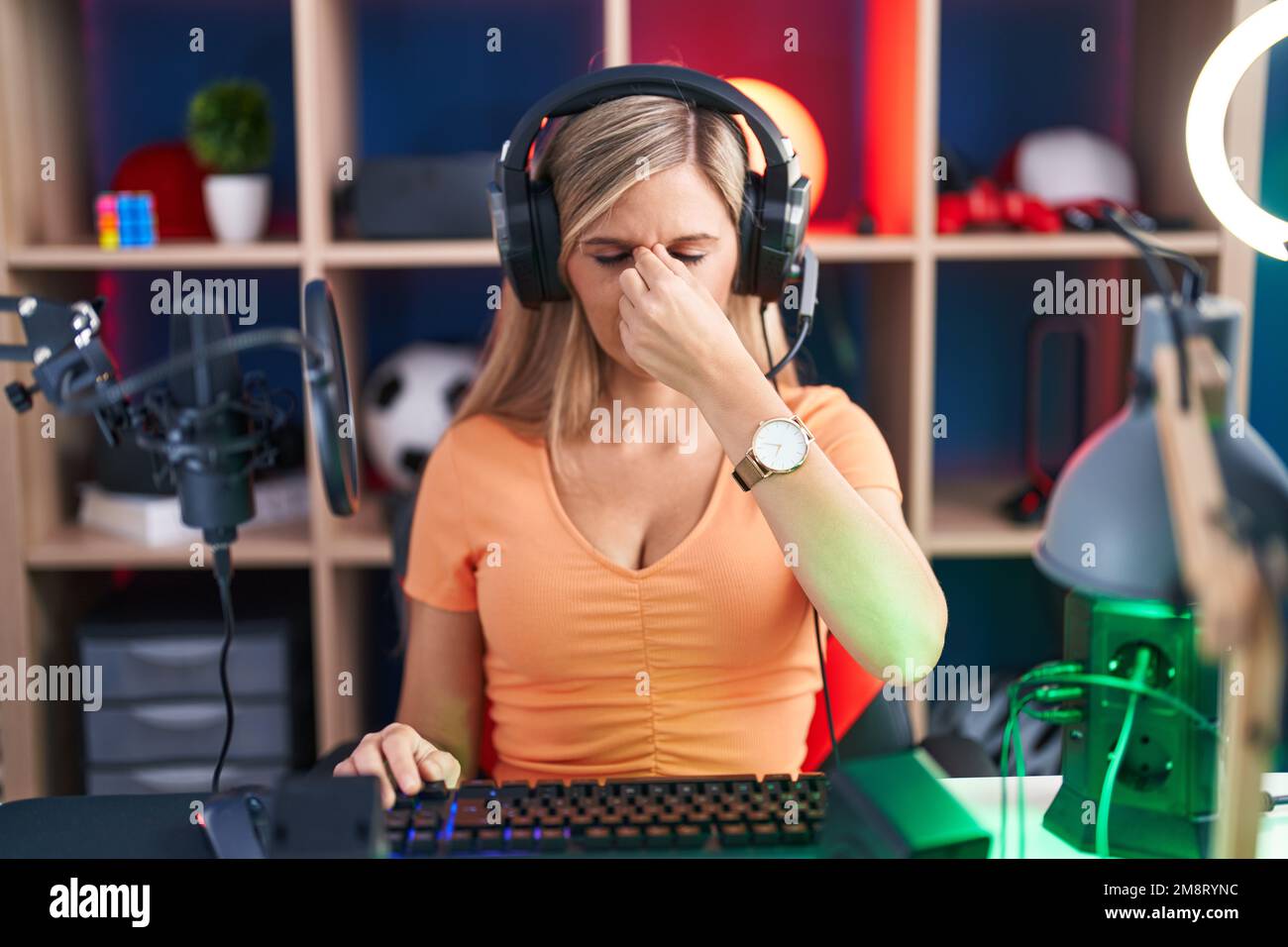 Tired female gamer playing video games hi-res stock photography and ...