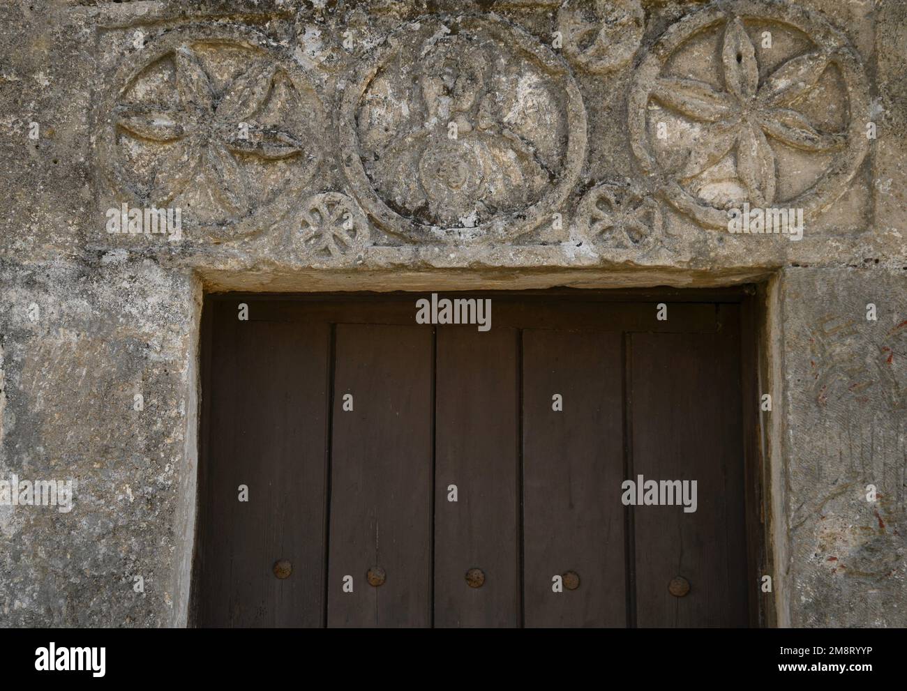 Stone carved religious symbols at the entrance of the Diocese of Saint ...