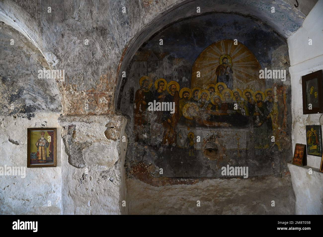 Ancient Byzantine church interior with frescoes and religious icons in ...