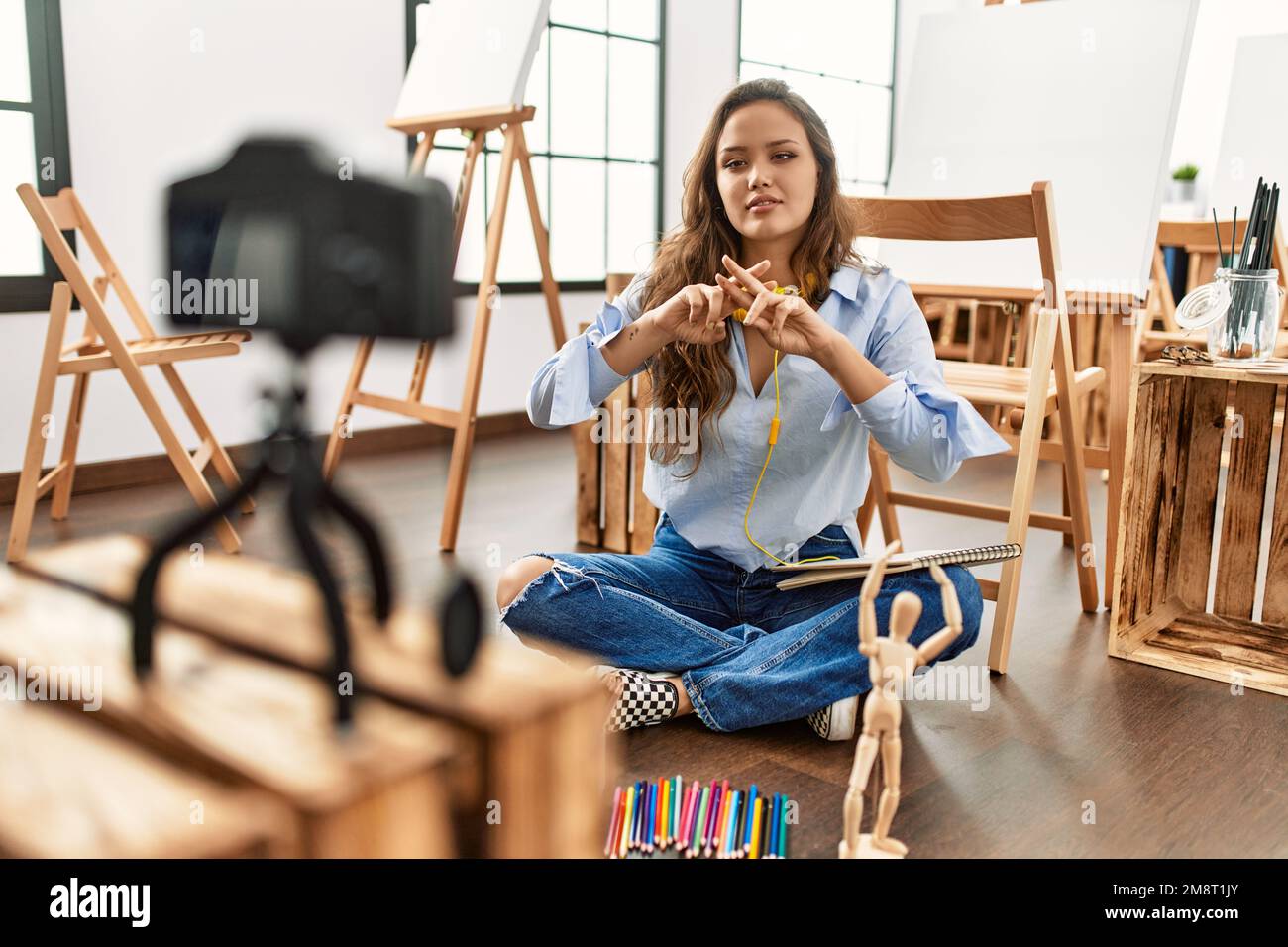 Young beautiful hispanic woman artist recording draw lesson communicate ...