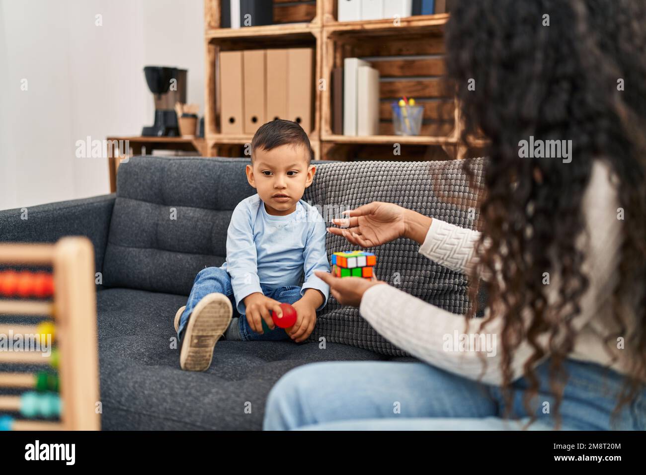 Mother and son having educational therapy at pedagogue center Stock ...