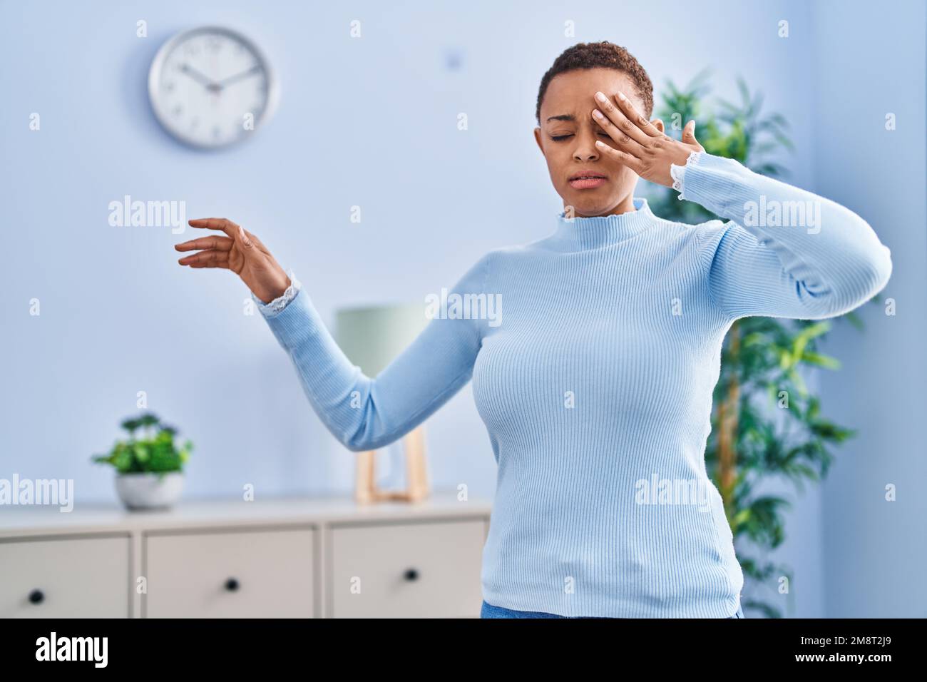 African american woman suffering dizzy standing at home Stock Photo - Alamy