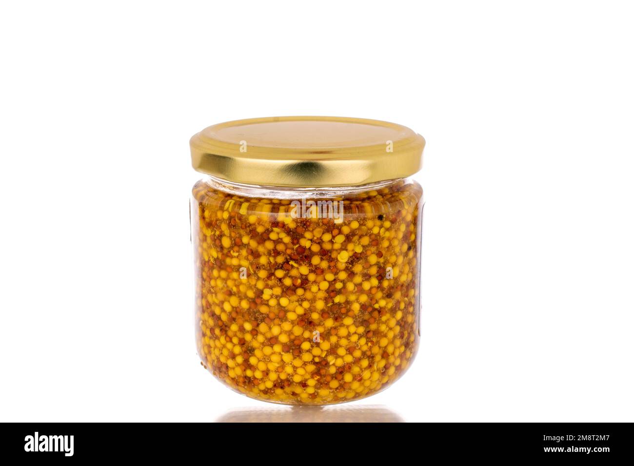 French mustard in a glass jar, macro, isolated on white background ...