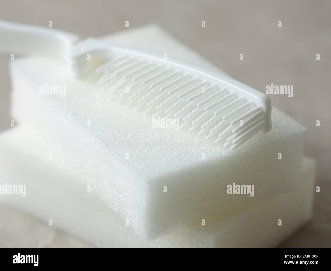 Disposable comb over bath sponge Stock Photo - Alamy