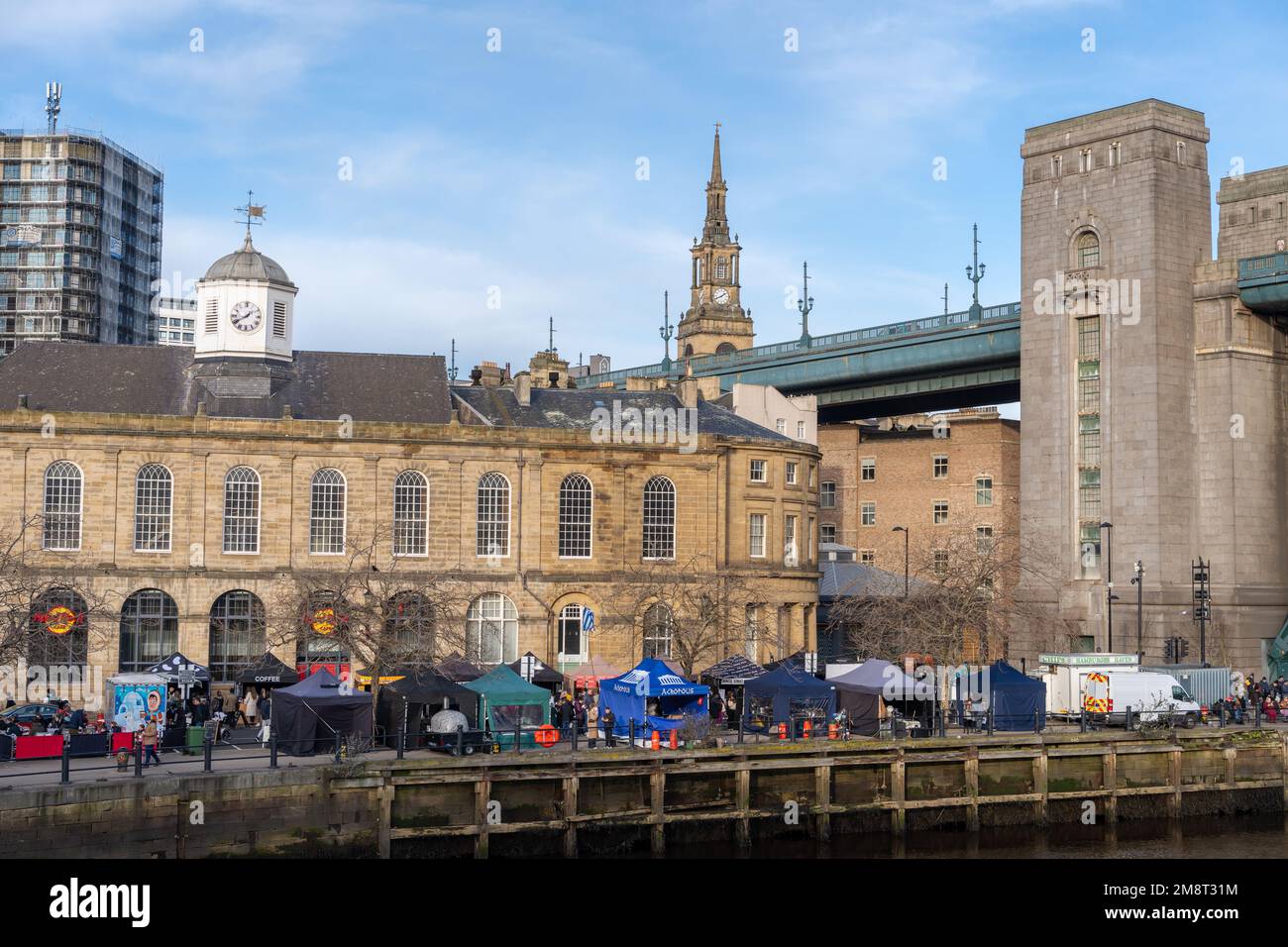 A view of the Quayside Sunday market, showing stalls by the Guildhall ...