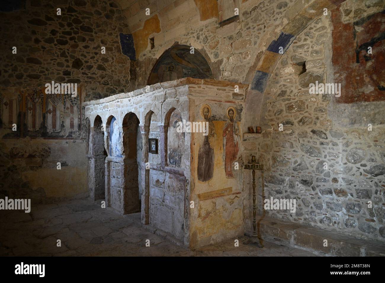 Ancient Byzantine church interior with frescoes and religious icons in ...
