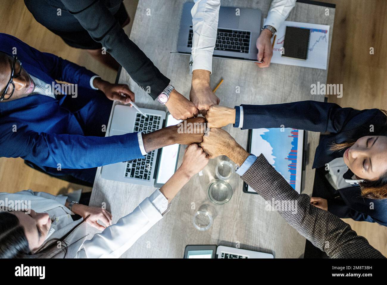 Fist bumb greeting and congratulations on the excellent teamwork, international business team ...