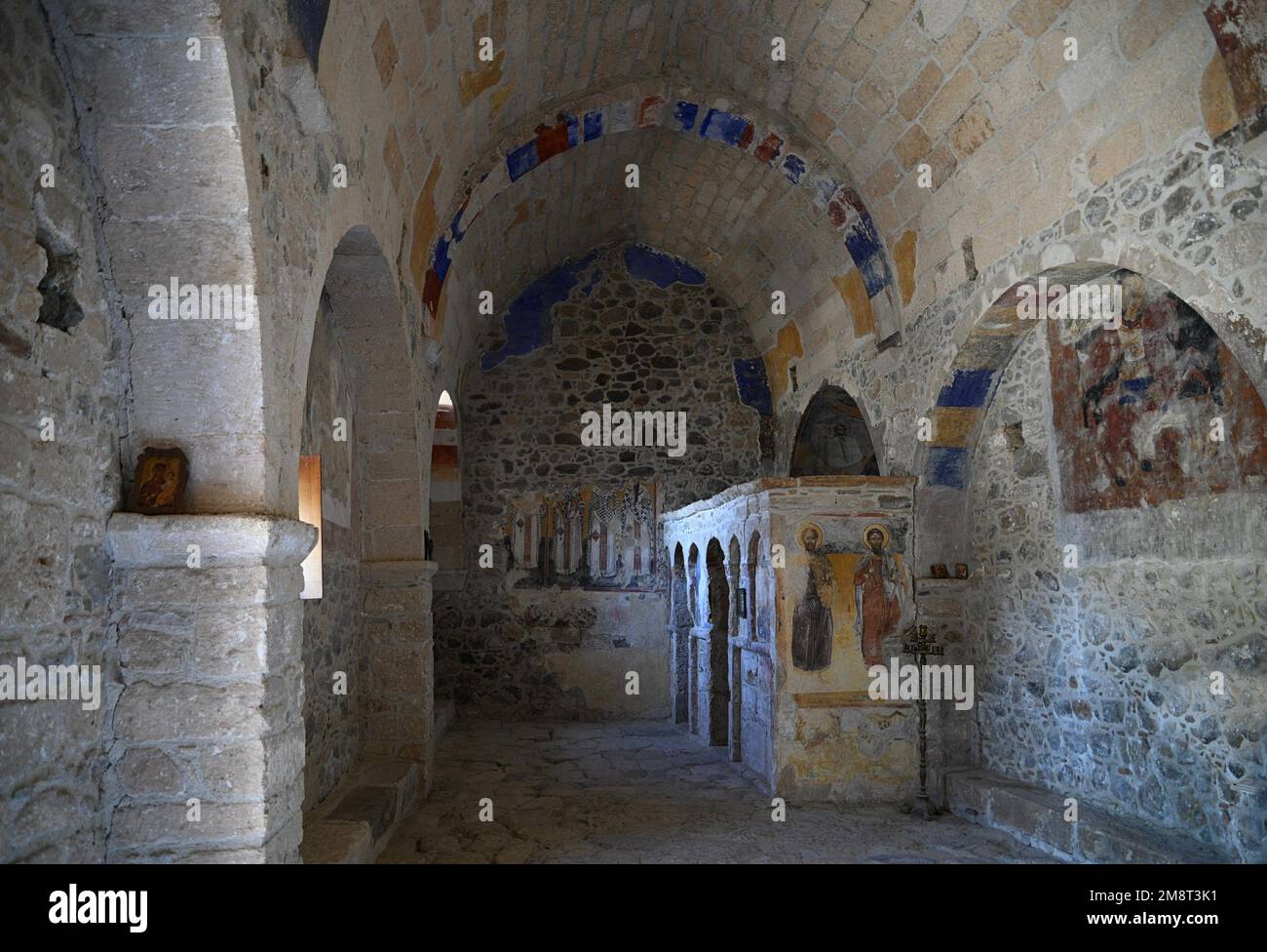 Ancient Byzantine church interior with frescoes and religious icons in ...