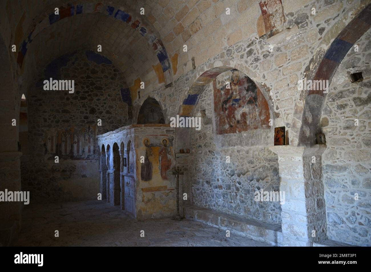 Ancient Byzantine church interior with frescoes and religious icons in ...