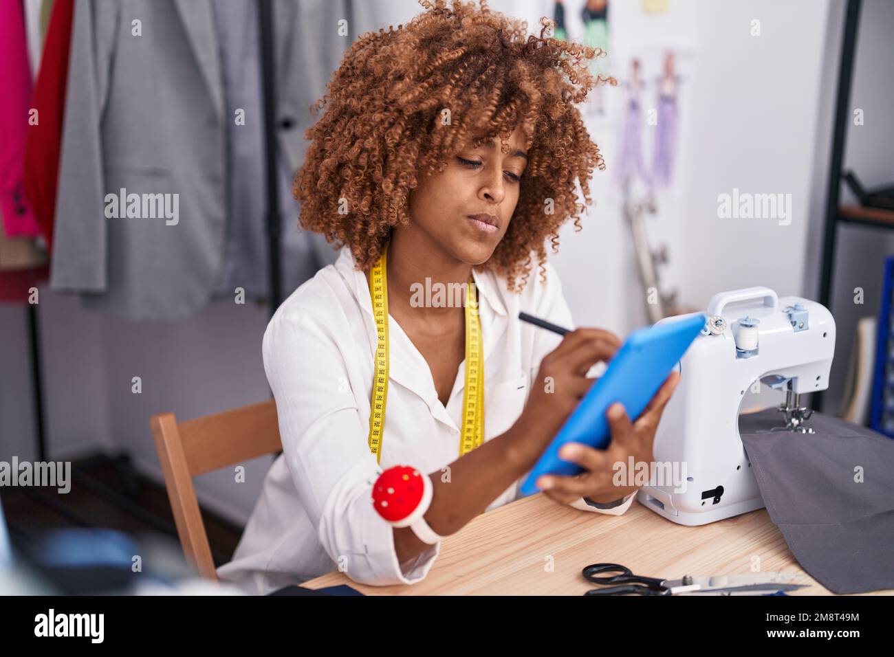 African american tailor drawing clothes hi-res stock photography and ...