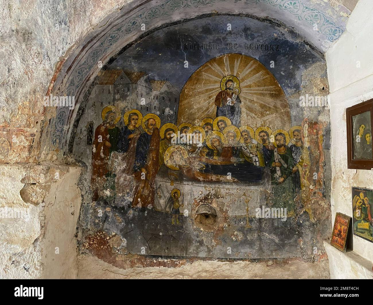 Ancient Byzantine church interior with frescoes and religious icons in ...