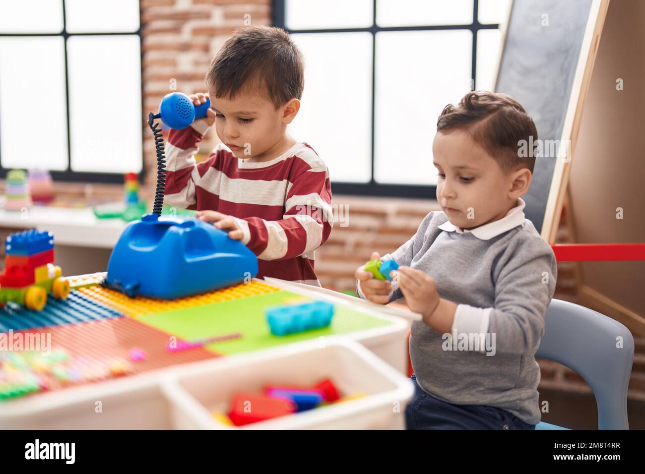 Kids playing phone table hi-res stock photography and images - Alamy