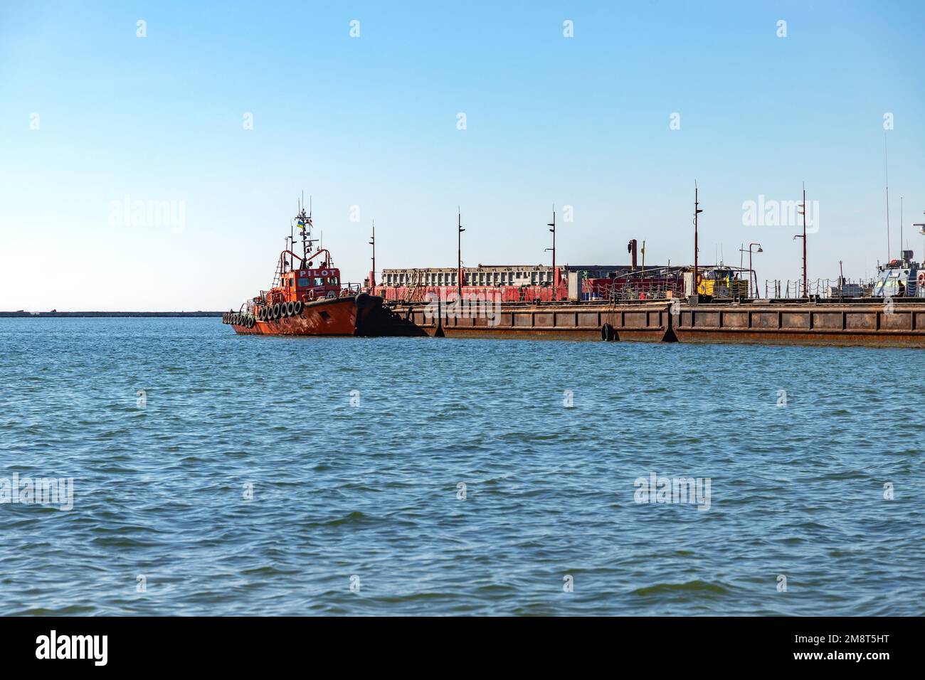 Boats and ships in cargo port of Berdyansk, Ukraine. Ukrainian cargo ...