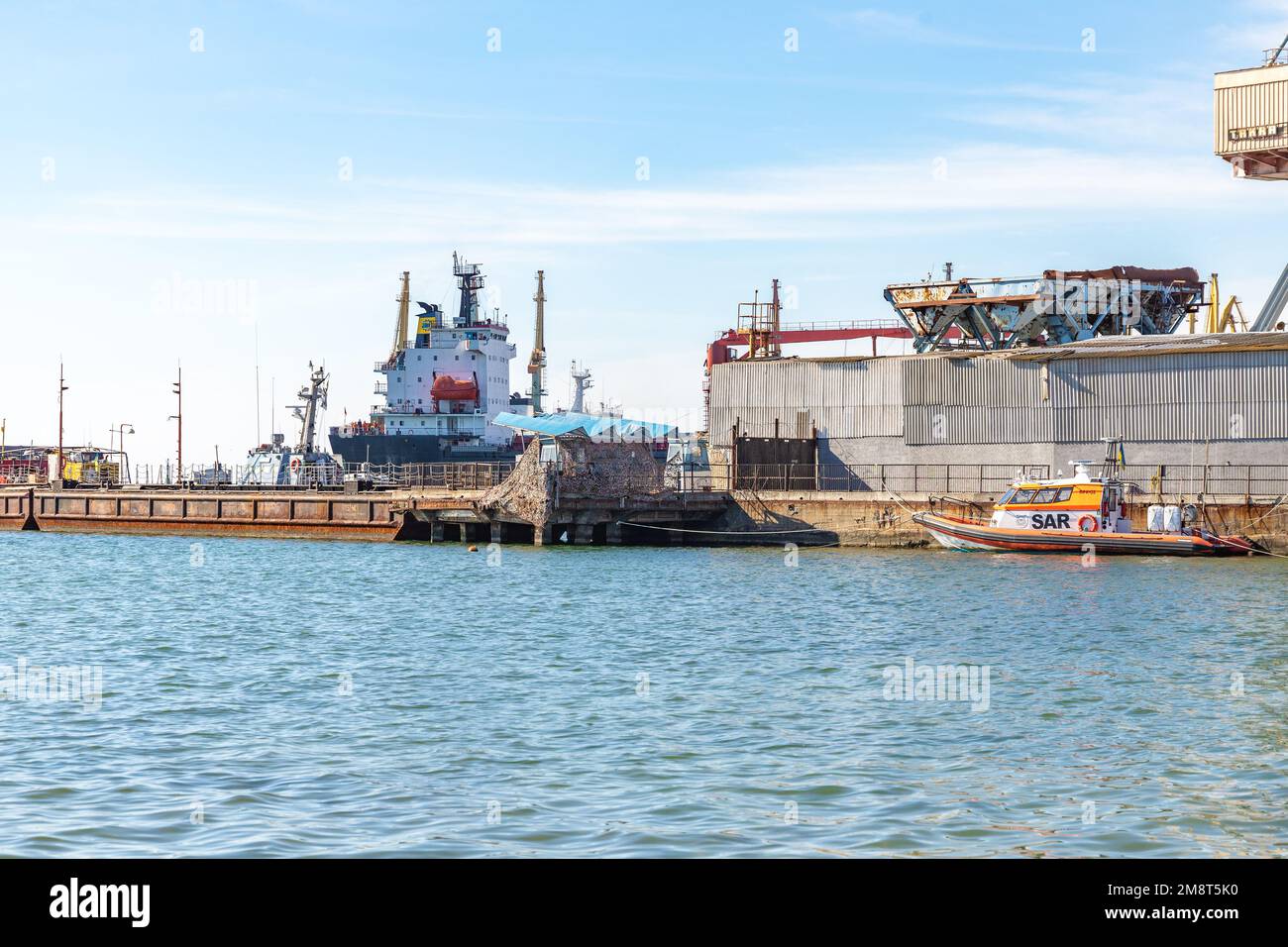 Boats and ships in cargo port of Berdyansk, Ukraine. Ukrainian cargo ...