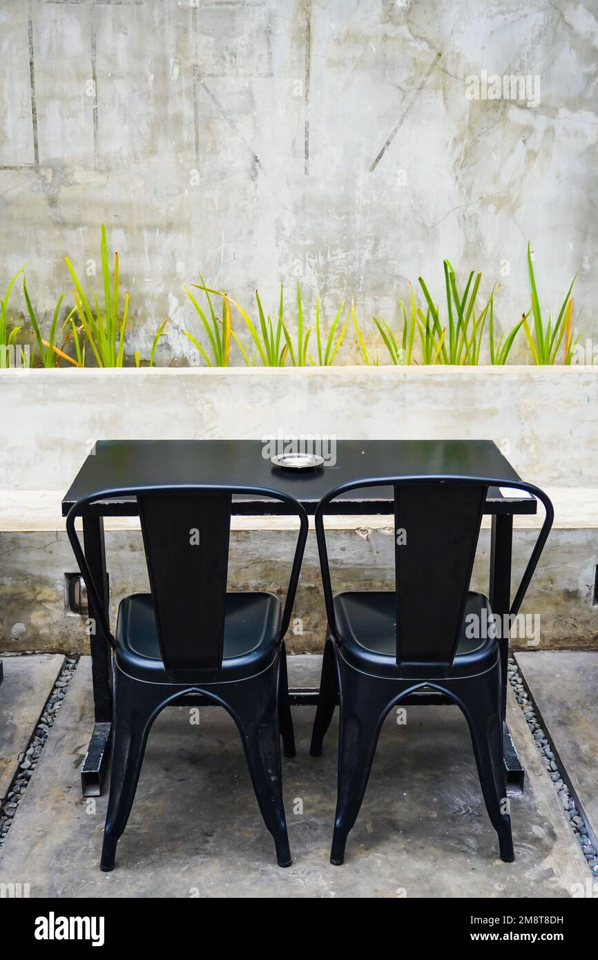 Portrait photo of cafe tables in the outdoor section Stock Photo - Alamy