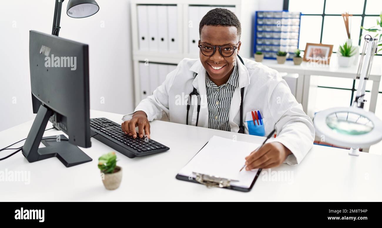 Young african man working as doctor at medical clinic Stock Photo - Alamy