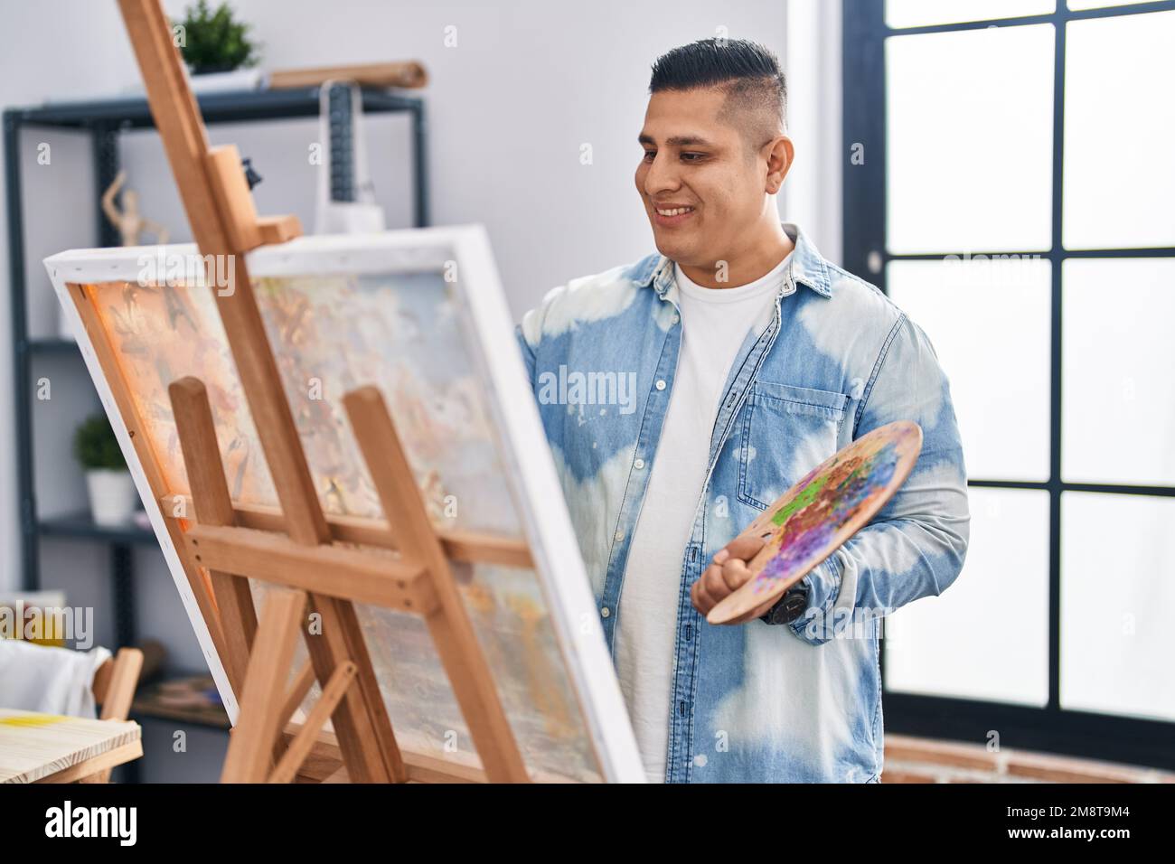 Confident young latin man artist hi-res stock photography and images ...
