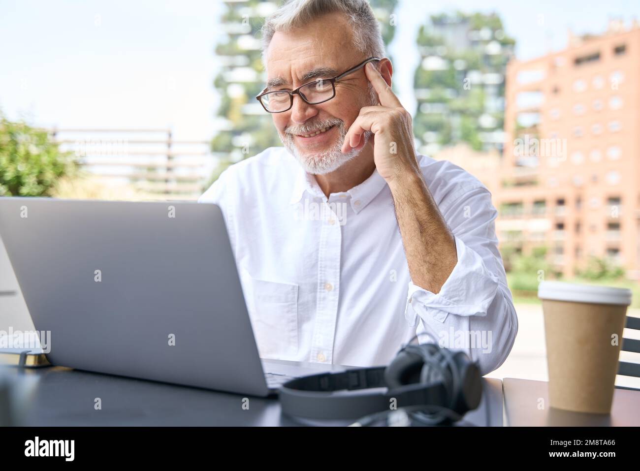Happy senior business man using laptop computer elearning sitting ...