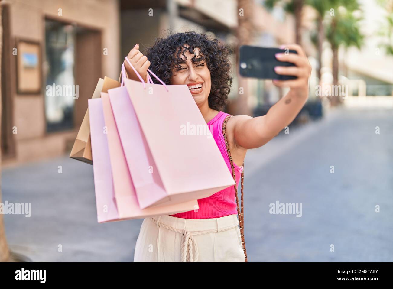 Young middle eastern woman customer smiling confident make selfie by ...