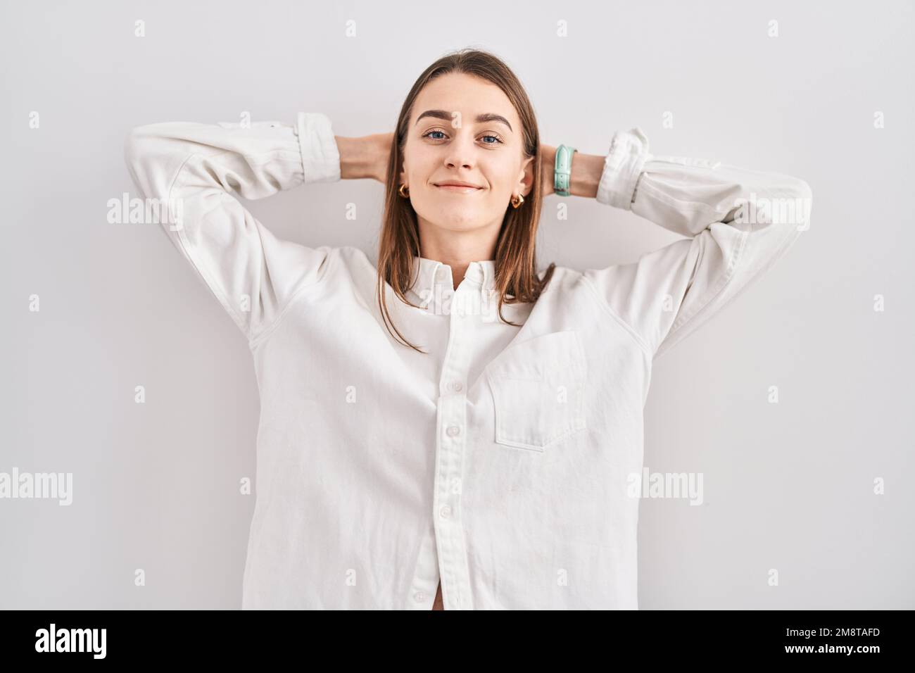 Young caucasian woman standing over isolated background relaxing and ...