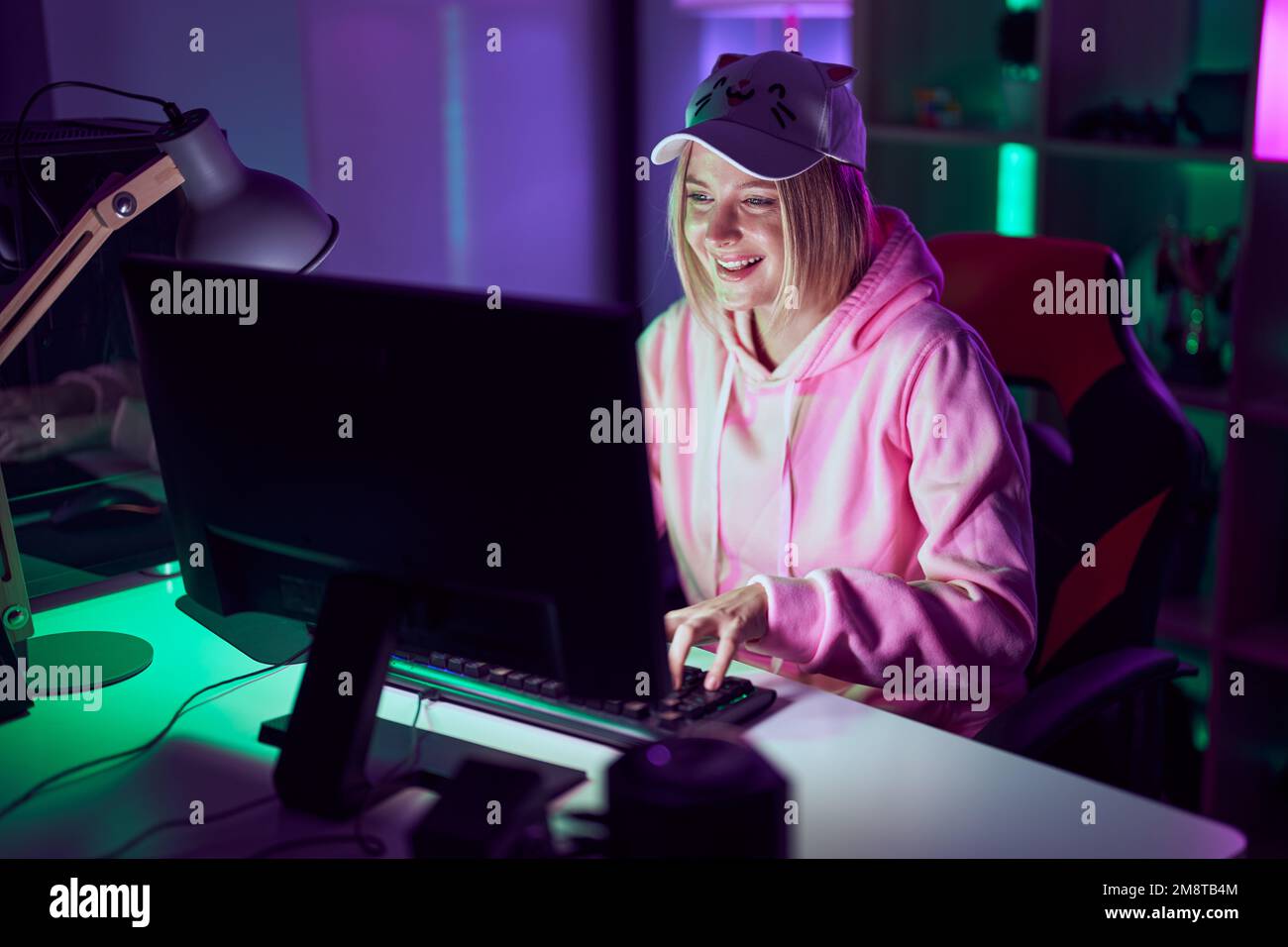 Young blonde woman streamer using computer at gaming room Stock Photo ...