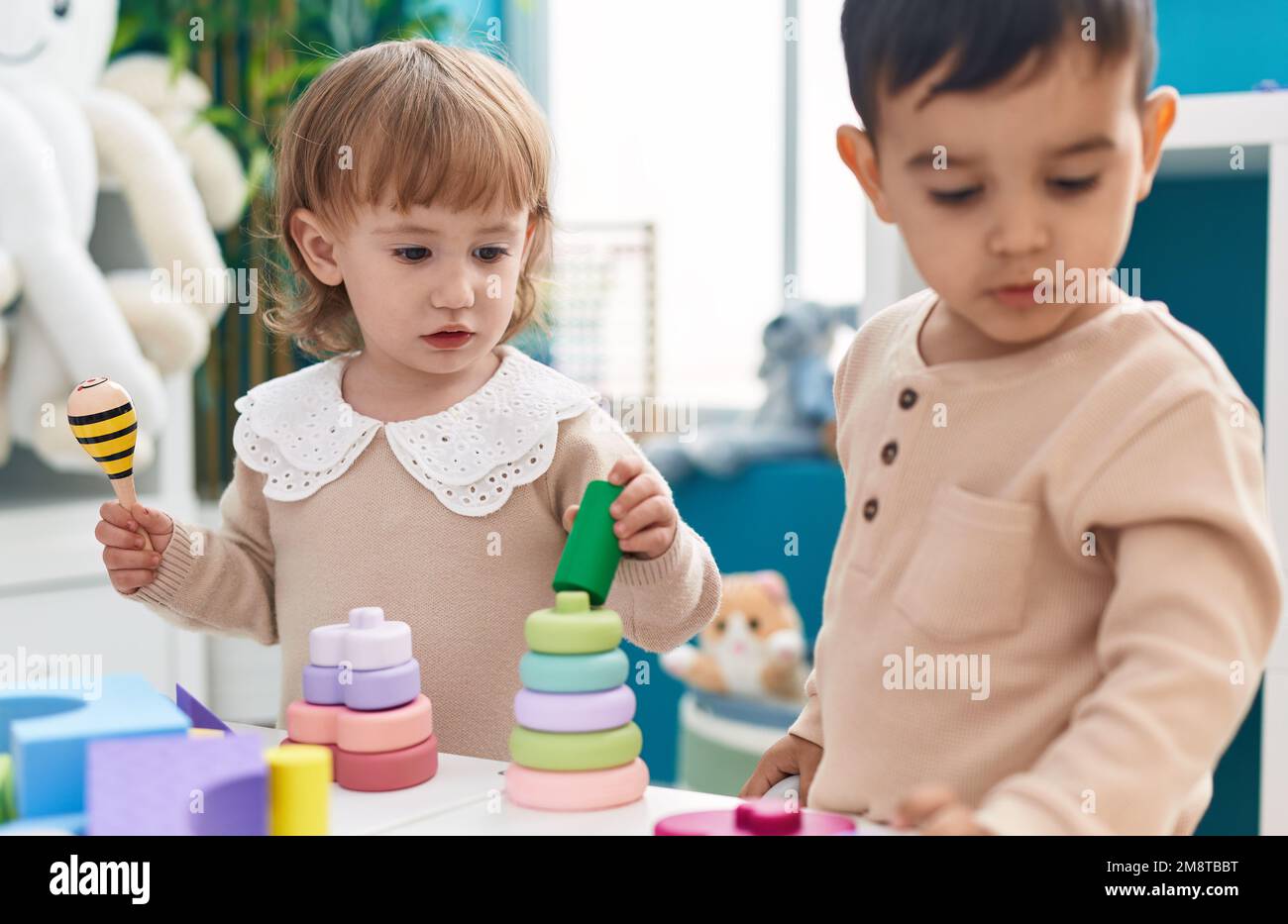 Hispanic kids playing with blocks hi-res stock photography and images ...