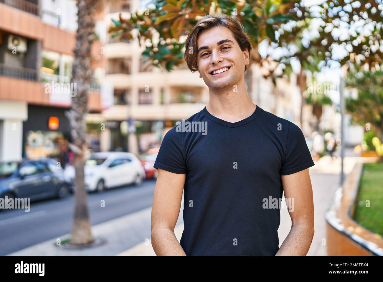 Young caucasian man smiling confident standing at street Stock Photo ...