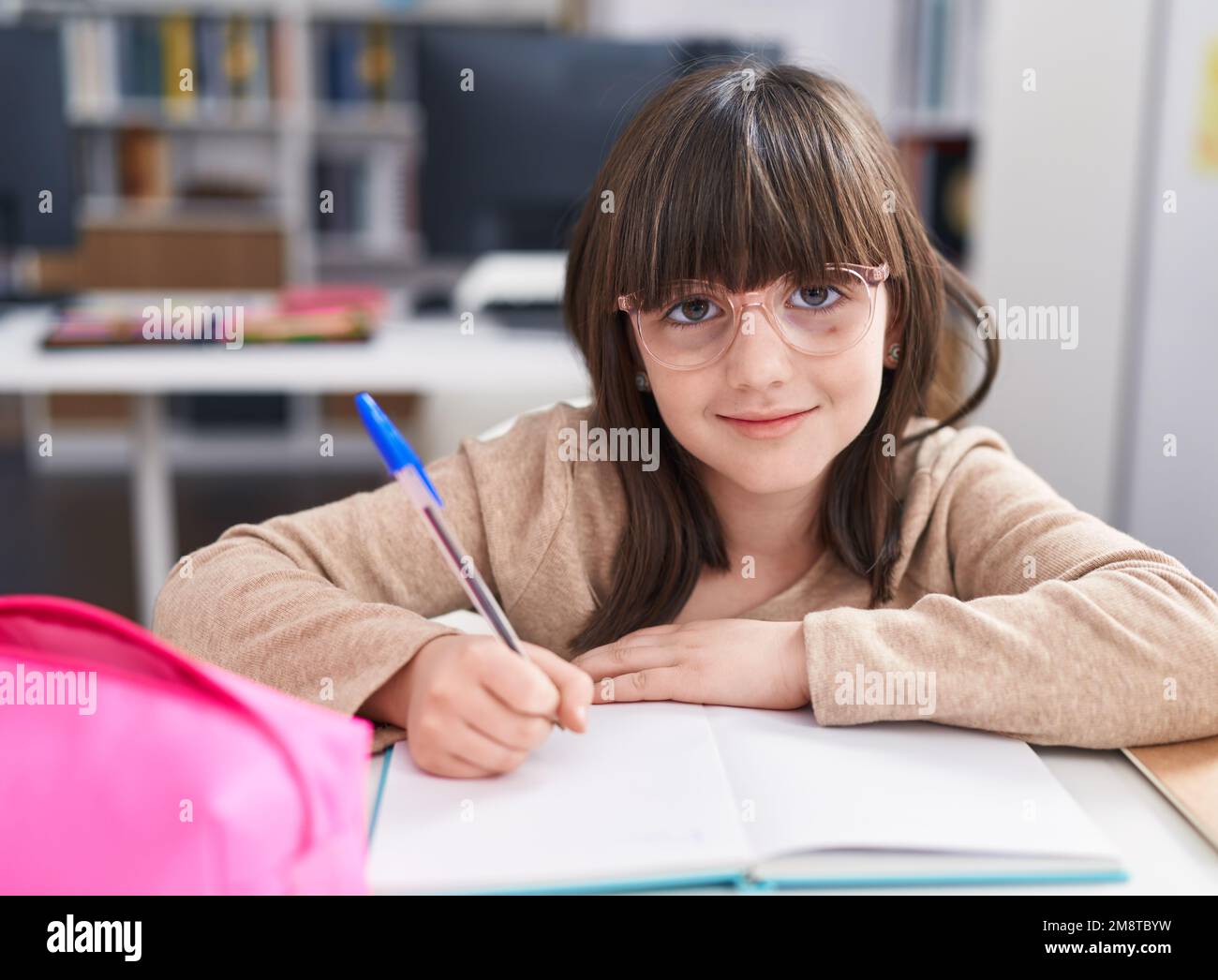 Adorable hispanic girl student sitting hi-res stock photography and ...
