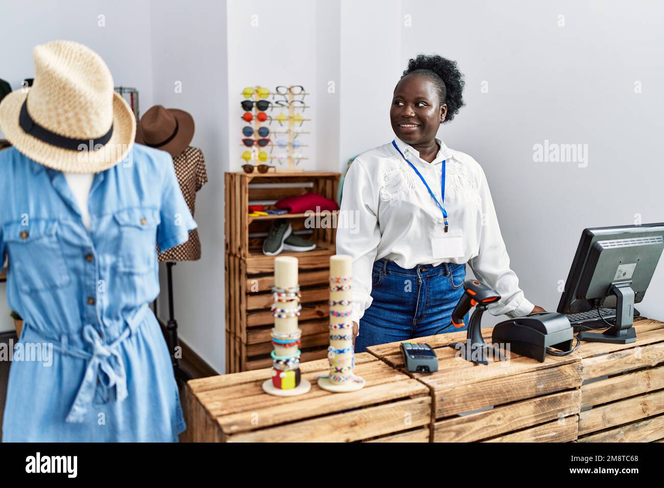 Young african american woman shopkeeper smiling confident standing at ...