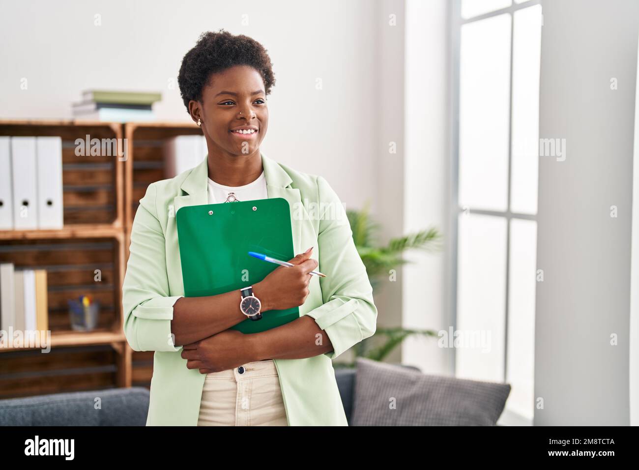 African american woman psychologist holding clipboard at psychology ...