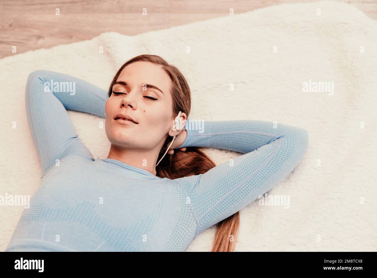 Top view portrait of relaxed woman listening to music with headphones ...
